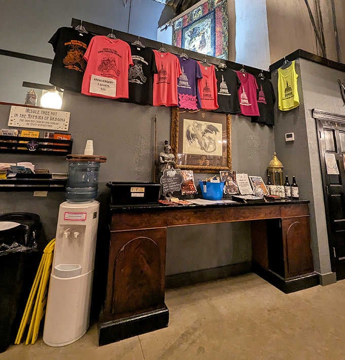 Colorful shirts hang like medieval banners, offering visitors a chance to take home a piece of this literary drinking den's unique magic.