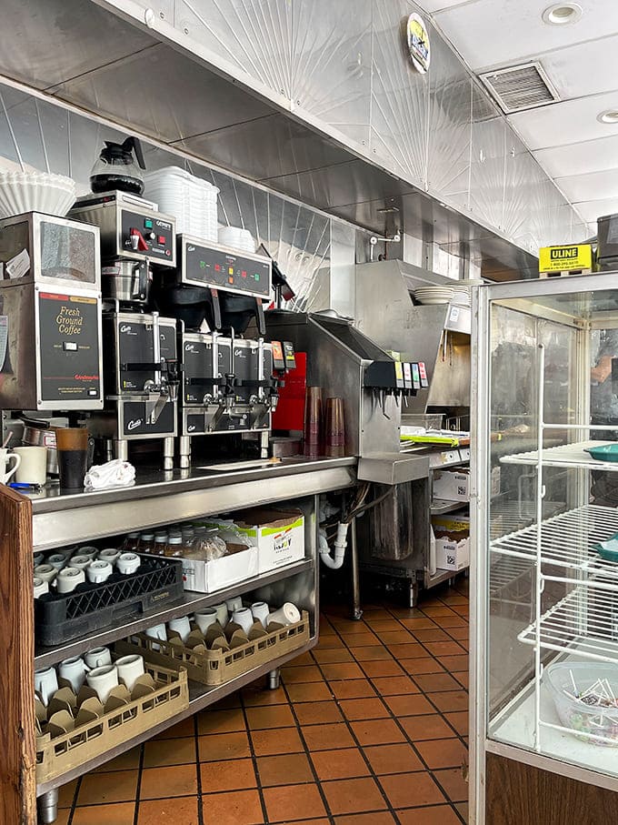 Behind the scenes magic where spatulas fly and eggs crack with one-handed precision &ndash; the engine room of breakfast dreams.