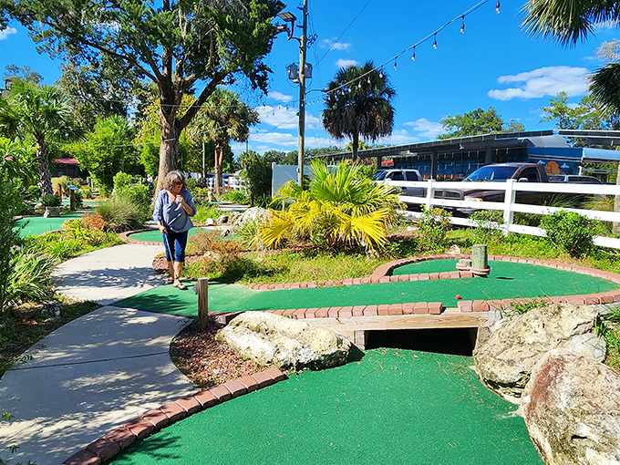 The mini-golf course winds through tropical landscaping, creating the perfect excuse to work up an appetite or work off that milkshake.