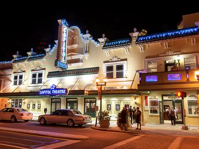 As night falls, the Capitol's illuminated exterior transforms Cleveland Street into a scene from entertainment's golden age.