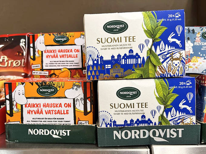 Colorful boxes of Nordqvist Suomi Tee featuring whimsical Moomin characters &ndash; Finnish tea that warms both body and soul.