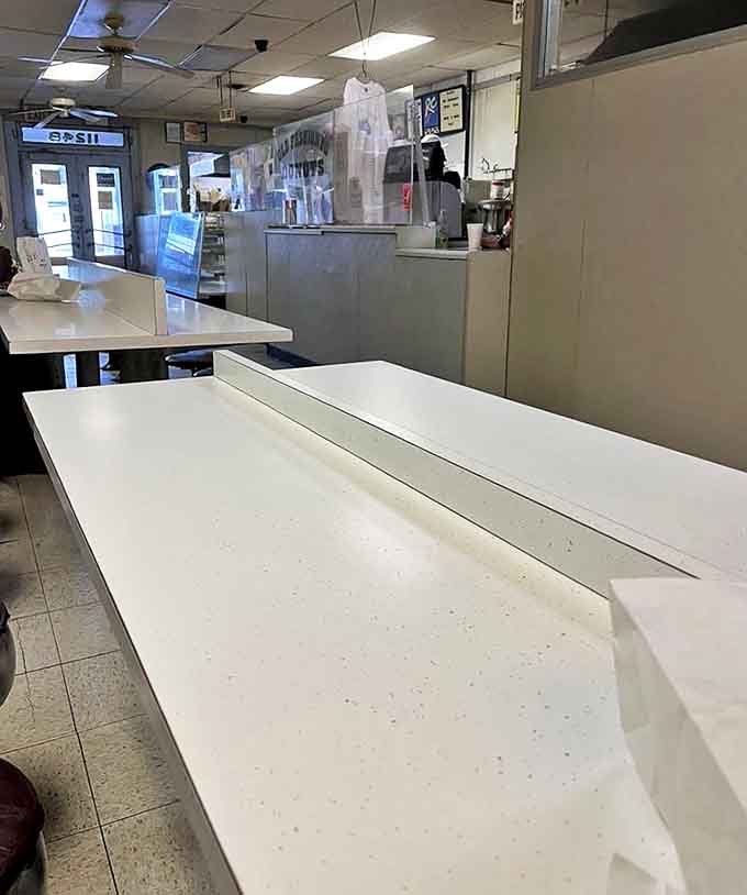 Clean, minimalist dining area that says, "We know why you're here, and it's not for the décor."