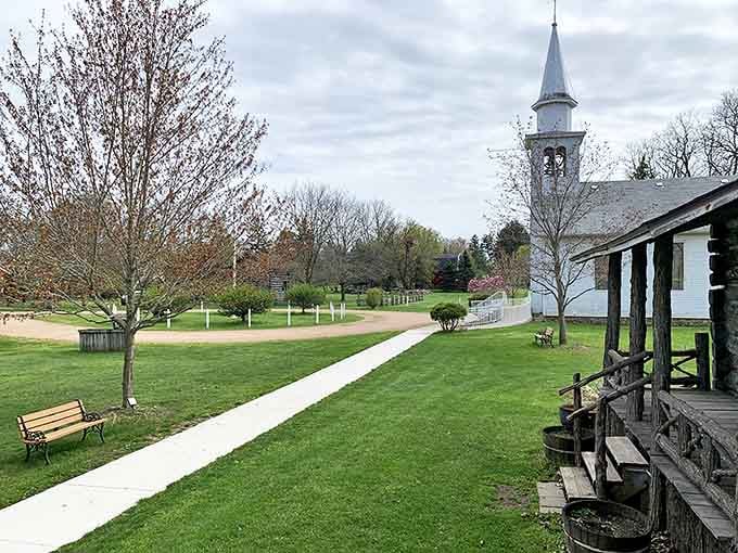 The village green offers a peaceful respite where visitors can contemplate life before smartphones demanded constant attention.