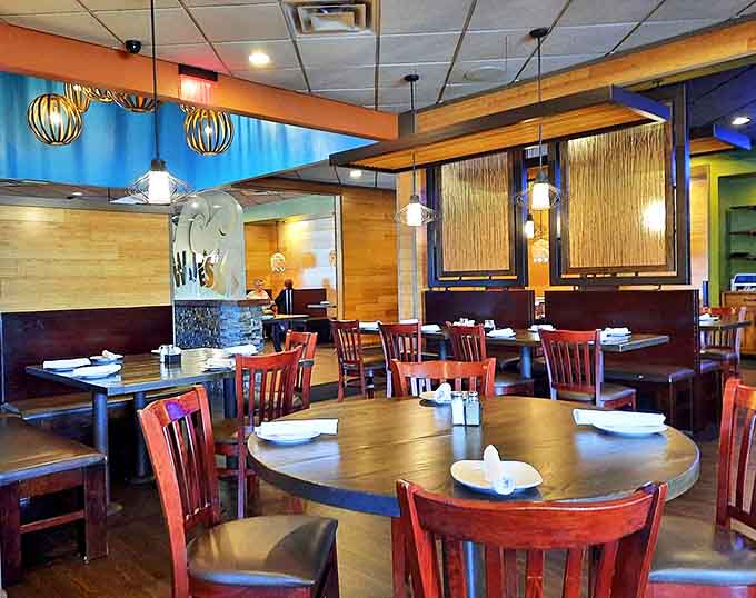 Where wood meets wave &ndash; the dining room's thoughtful design creates intimate spaces perfect for both date nights and family gatherings.