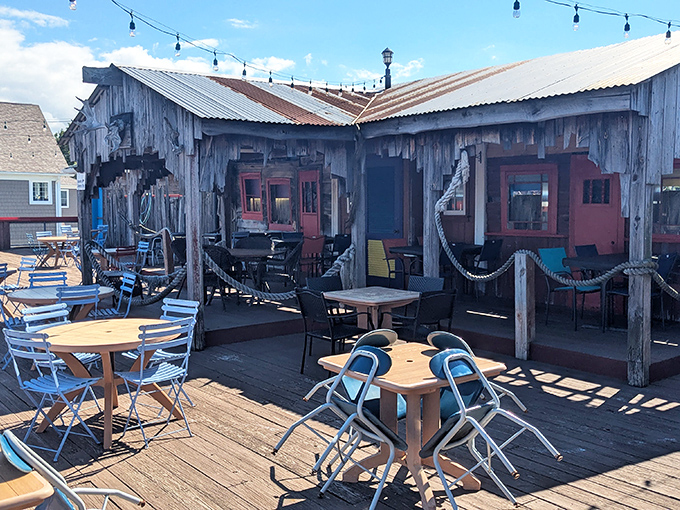 Weathered wood, nautical charm, and fresh air – this deck feels like discovering a secret fishing village where seafood tastes even better.