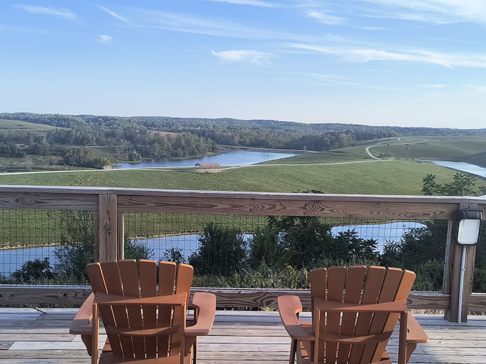 Two Adirondack chairs invite contemplation of life's big questions while overlooking a view that makes those questions seem less pressing.