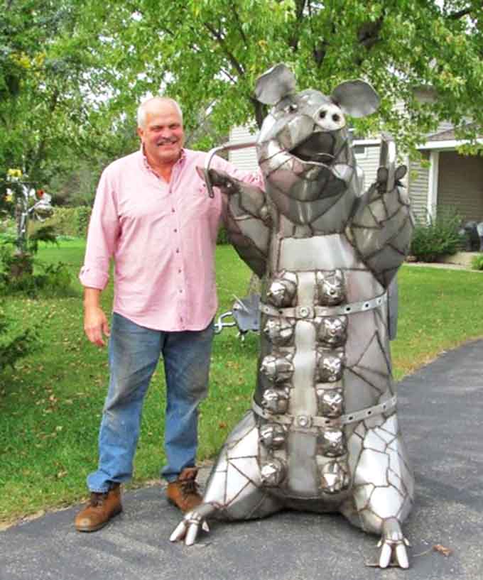 This colorful patchwork pachyderm brings circus-like joy to the garden, its vibrant panels and wide-open mouth trumpeting a cheerful welcome.