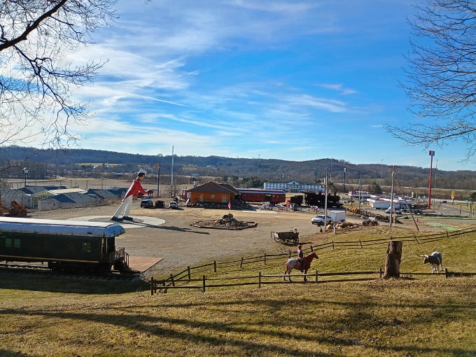 A panoramic view reveals the full scope of this roadside wonderland, where trains, statues, and bobbleheads coexist harmoniously.