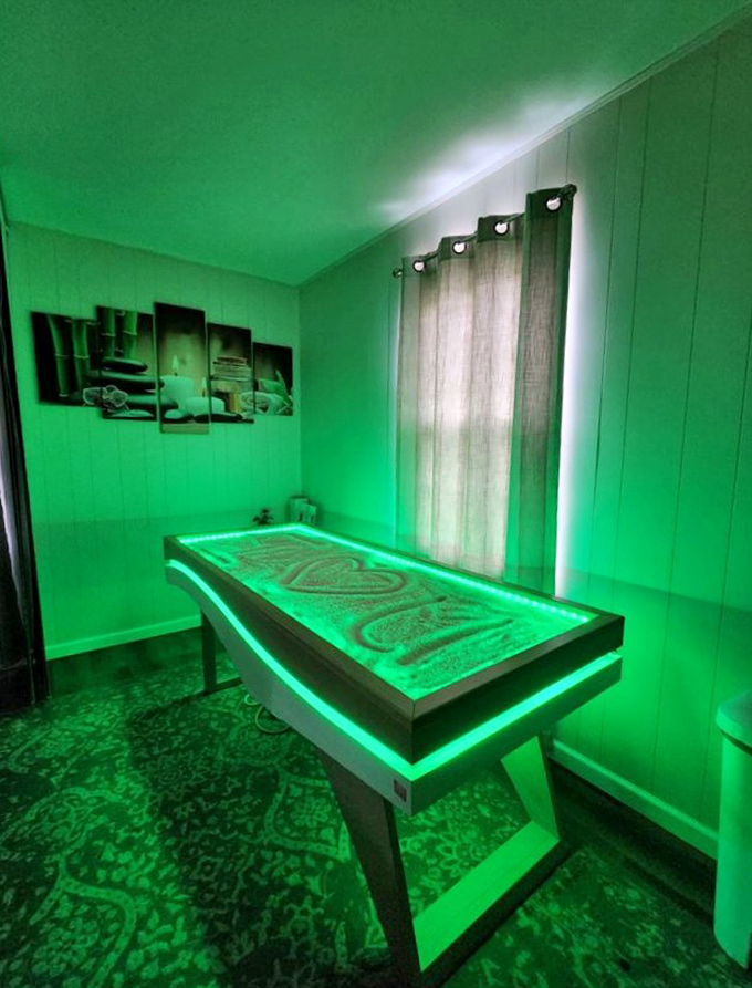 This serene treatment room offers modern relaxation with a distinctive green glow &ndash; proof that Arthur embraces wellness in unexpected ways.