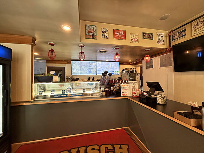 The service counter is where dreams come true and orders are placed, staffed by friendly folks who won't judge you for ordering three apple fritters for "later."