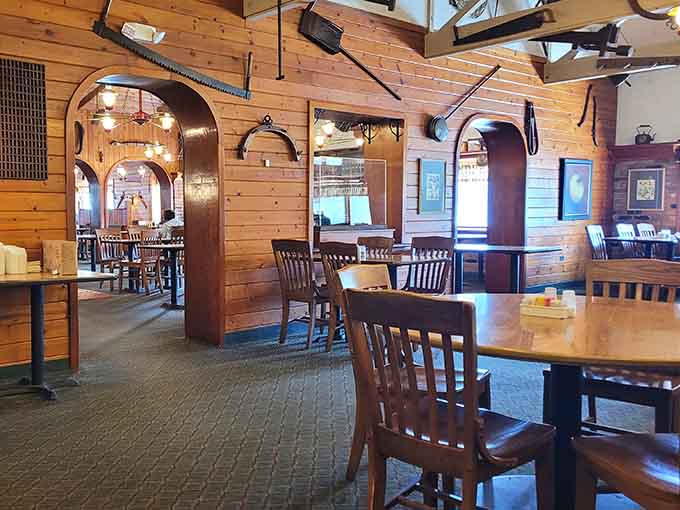 Arched doorways and comfortable seating throughout create intimate spaces within the larger dining room, perfect for everything from family gatherings to quiet meals.