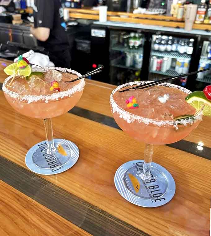 These gorgeous cocktails with their salt-rimmed glasses and fruity garnishes are summer in liquid form.