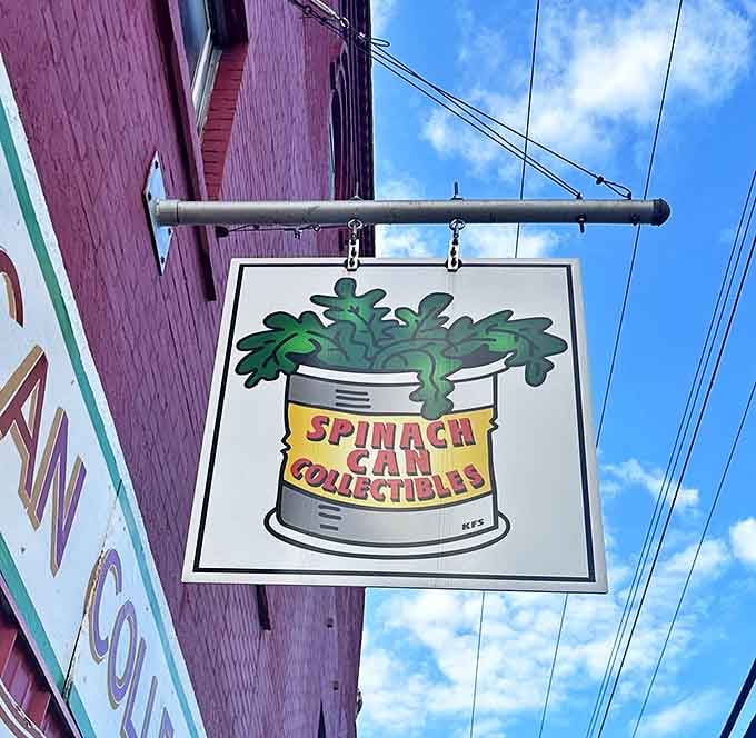 The Spinach Can Collectibles sign announces this treasure trove of nostalgia with appropriate whimsy, promising adventures in cartoon history just beyond the door.