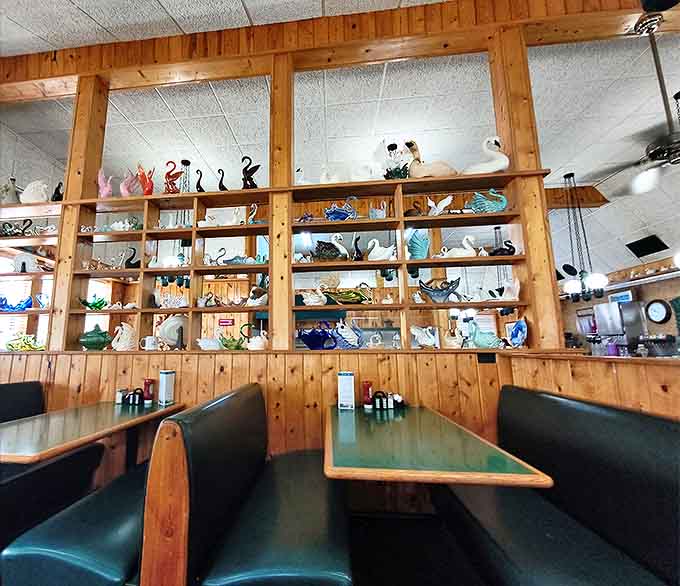 Swan's Cafe's collection of teapots and figurines watches over diners from wooden shelves, each piece telling its own story while you enjoy yours over coffee.
