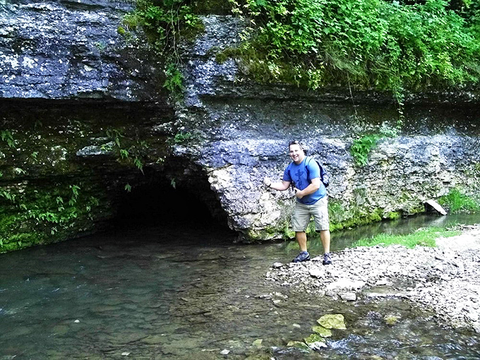 The Big Spring emerges from the earth, its clear waters flowing from underground sources that have traveled through miles of limestone.