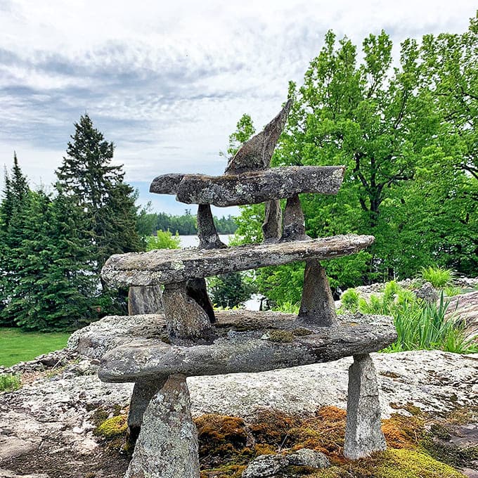 This three-tiered stone sculpture resembles a primitive altar or ancient monument, its balanced rocks creating a conversation between stability and precariousness.