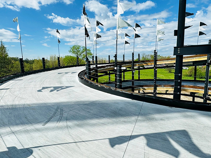 The upward spiral creates natural spacing between karts, ensuring your racing experience isn't ruined by the tourist who thinks the brake is the fun pedal.