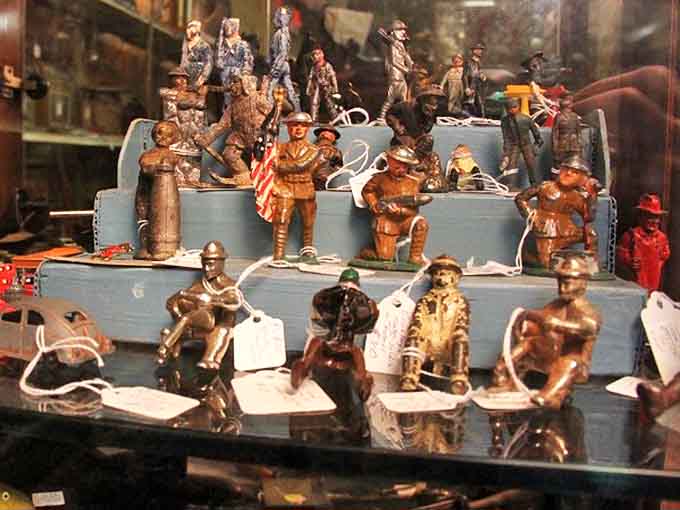 Tiny metal guardians of history stand at attention—each figurine representing a different era of craftsmanship and childhood imagination.