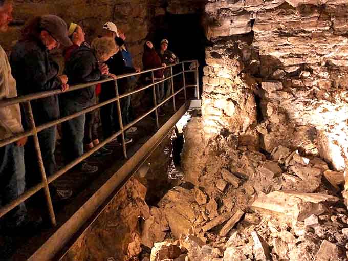 Underground explorers: Visitors gather along the safety railings to marvel at Mystery Cave's ancient formations and listen to their guide's explanations.