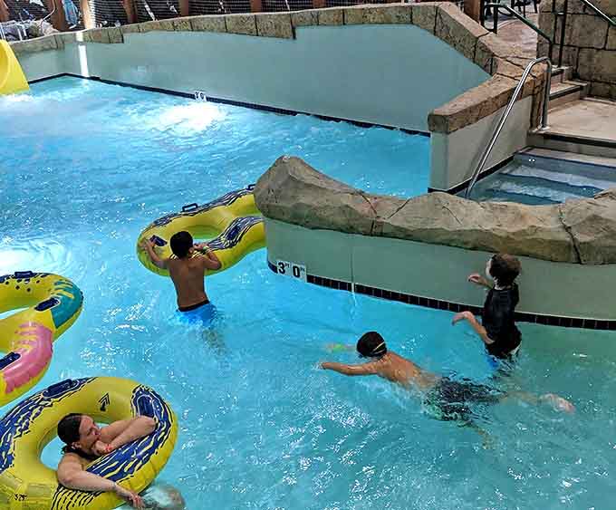 Families float in colorful tubes through gentle currents, creating the perfect balance of relaxation and play in the lodge's carefully designed pools.
