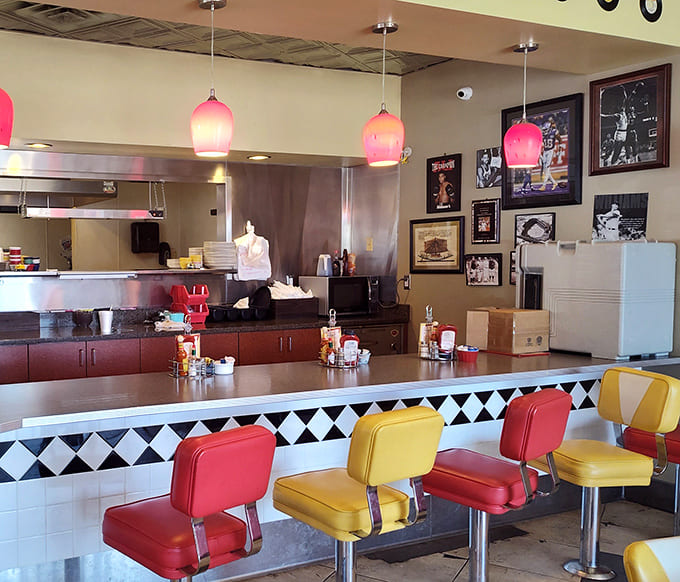 Counter seating: Where solo diners become part of the Ze's family, perched on cherry-red and sunshine-yellow stools watching culinary magic unfold.
