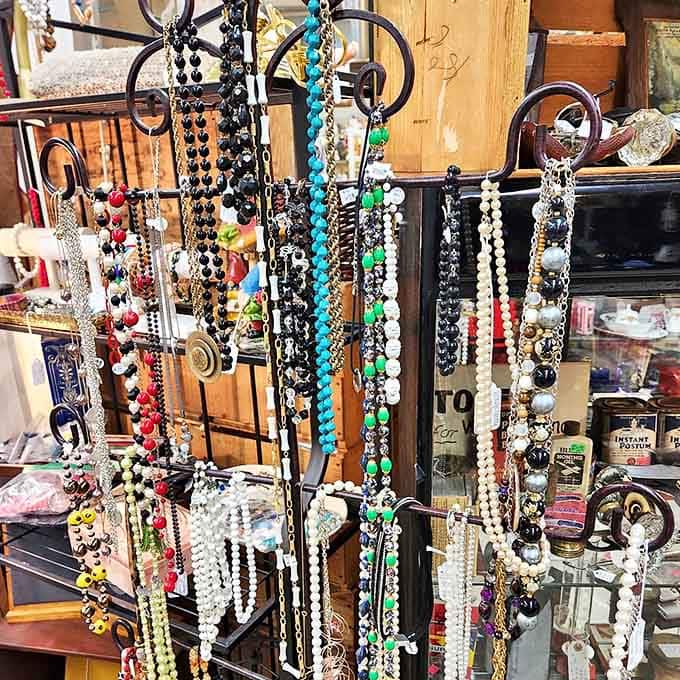 Vintage necklaces and costume jewelry dangle invitingly, each piece whispering stories of special occasions from decades past.