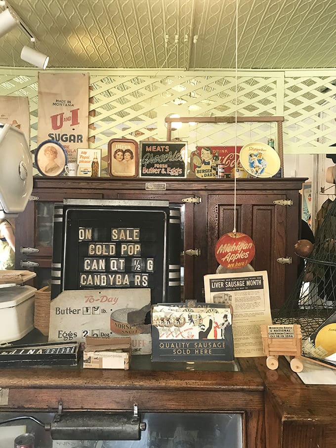 Advertisements tell stories of changing American values – "Butter 1¢/lb" and "Quality Sausage Sold Here" speak of simpler commercial promises.