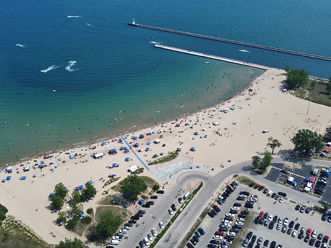 From above, Waukegan Beach reveals its perfect crescent shape, a golden smile along Lake Michigan's blue face.
