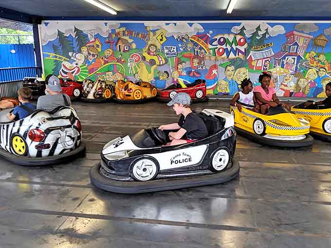 The bumper car arena transforms quiet family members into tactical driving geniuses, where rubber-cushioned revenge is served with a side of giggles.