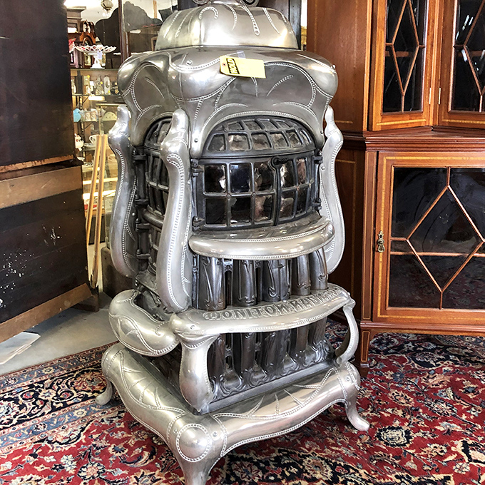 This isn't just a stove; it's a household monument. Cast iron parlor stoves like this one were once the literal and figurative heart of American homes.