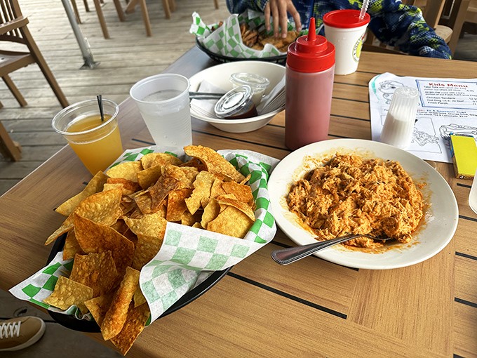 Casual lakeside dining where comfort food meets vineyard views &ndash; chips and dip never had a more spectacular backdrop.