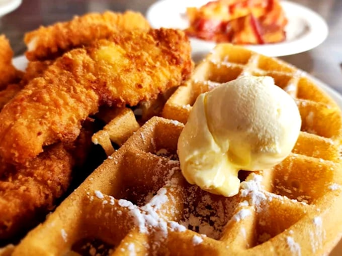 Golden fried chicken meets fluffy waffle with a scoop of butter slowly melting between them &ndash; a marriage of flavors that never goes out of style.