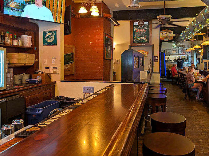 The bar area - where locals gather to watch games, share stories, and wait for their chance at burger bliss.