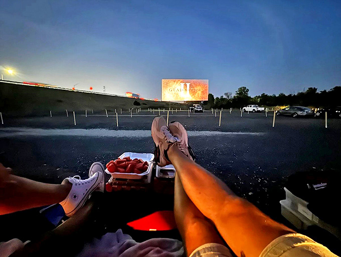A laid-back date night turns your car into the best seat in the house, with feet up, shared snacks, and the big screen glowing ahead.