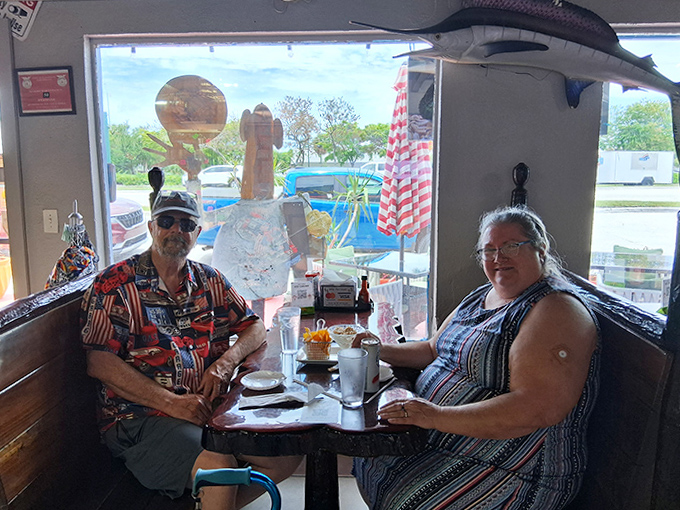 Happy customers enjoying the fruits of the sea in unpretentious surroundings &ndash; the hallmark of authentic Florida Keys dining.