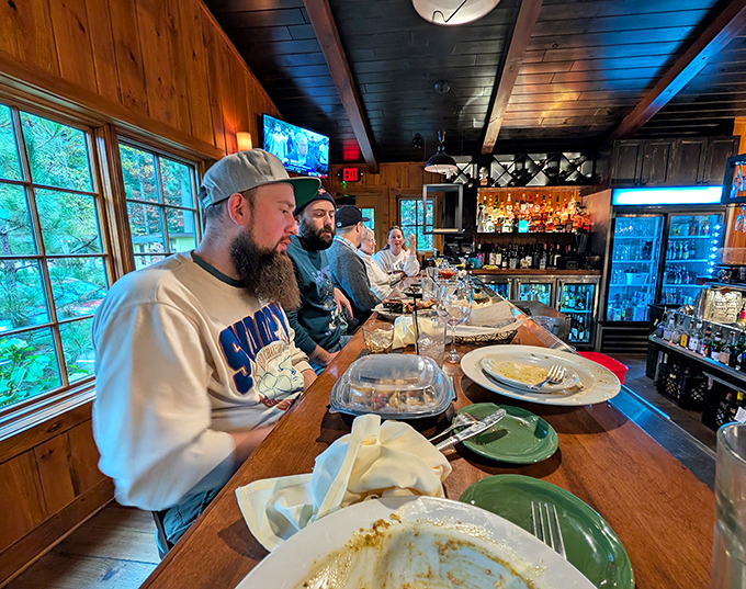 Happy diners enjoying the fruits of Norway Ridge's culinary labor &ndash; where conversation flows as freely as the excellent wine selections.