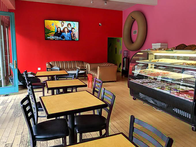 The seating area becomes a community hub where strangers bond over their mutual appreciation for exceptional baked goods.