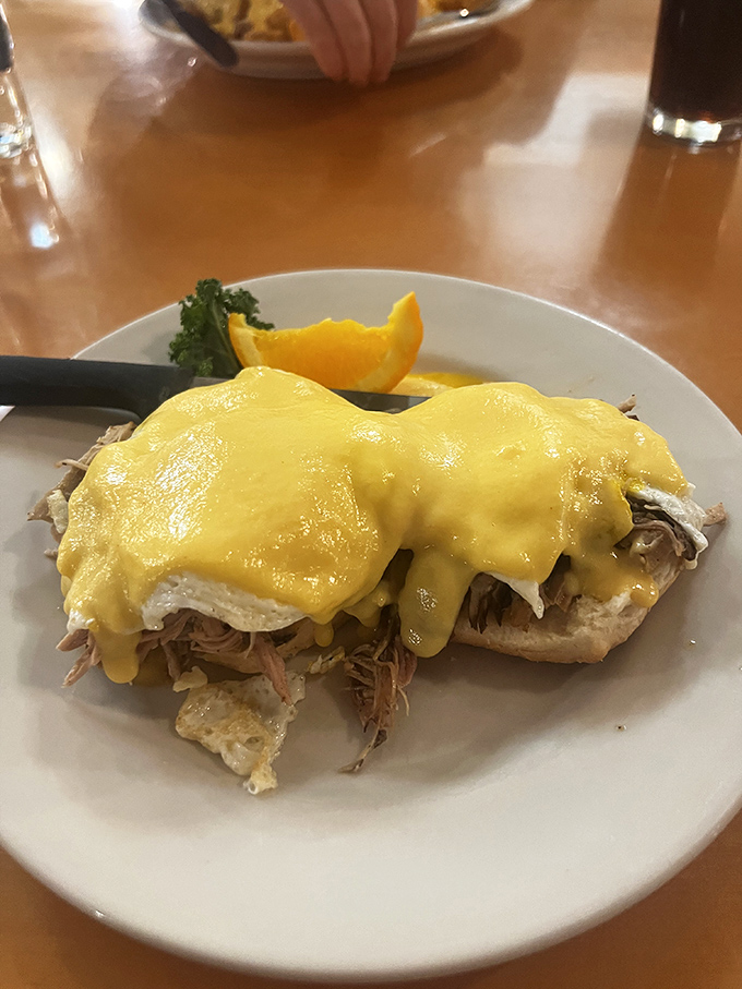 The incredible Pulled Pork Eggs Benedict, featuring tender meat, perfectly poached eggs, and rich hollandaise&mdash;a Tobie's must-try!