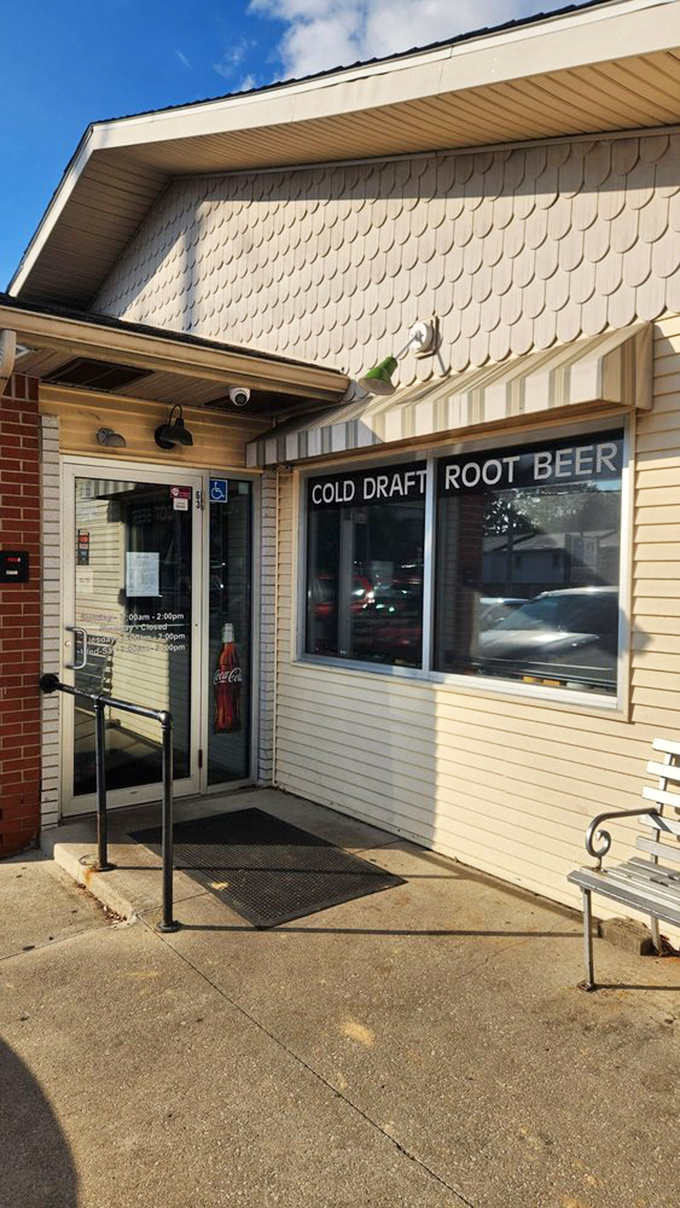The unassuming exterior with its "COLD DRAFT ROOT BEER" promise is like a secret handshake – those who know, know what deliciousness awaits inside.