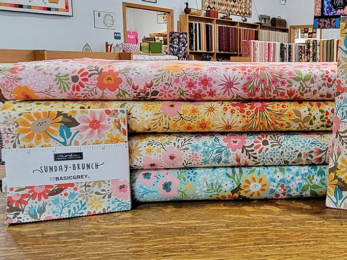 Floral fabrics bloom year-round at The Quilt Peddler, bringing perpetual spring regardless of Wisconsin's actual weather conditions outside.