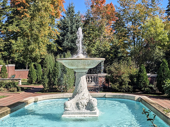Water dances from this ornate stone creation, the focal point of gardens designed to impress guests and make neighbors question their landscaping choices.