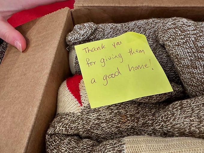 "Thank you for giving them a good home!" – A heartfelt note accompanies donated sock monkeys, speaking to their sentimental value.