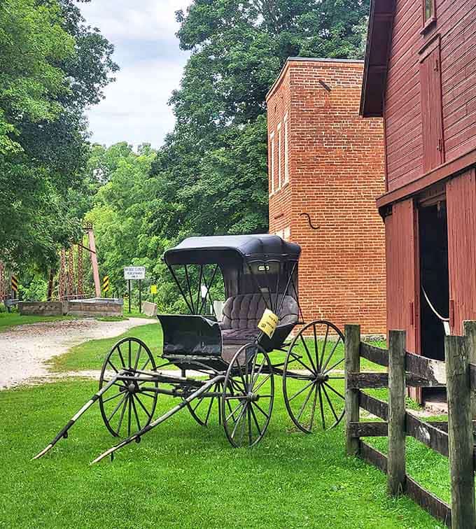 This meticulously preserved horse-drawn buggy stands ready for service, a reminder of when transportation moved at a more contemplative pace.