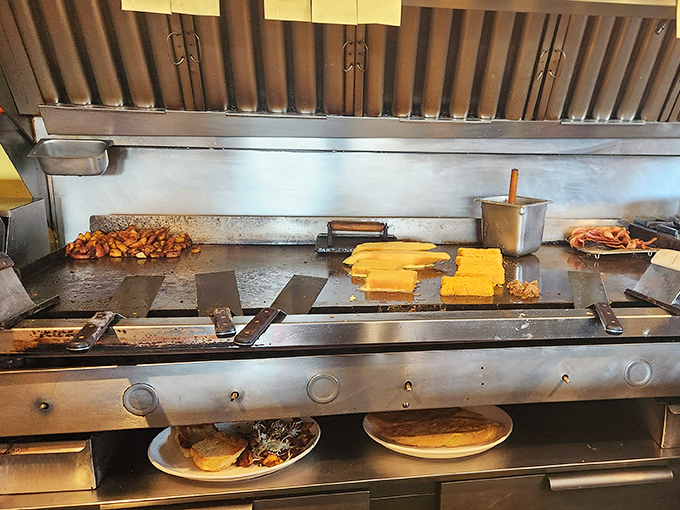 Where the magic happens – the compact kitchen that somehow produces enormous flavors and even bigger portions.