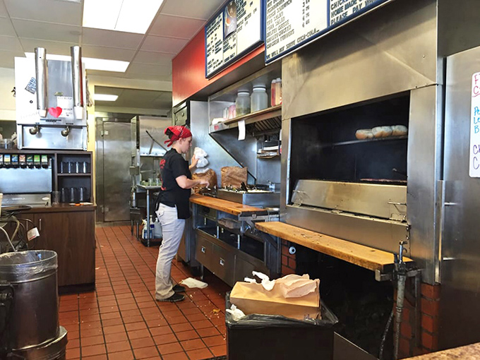 Behind the scenes magic: the kitchen where burger dreams come true. That charcoal grill is the heart of the operation.