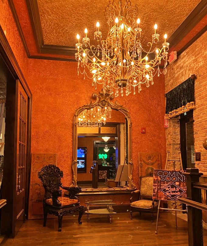 The lounge area whispers, "Stay awhile," with a chandelier that's seen more secrets than a Prohibition-era telephone operator.