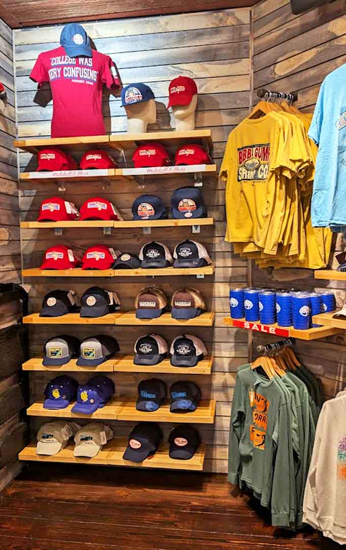 The merchandise corner offers the perfect souvenir opportunity – because nothing says "I vacationed thoughtfully" like a Bubba Gump baseball cap.