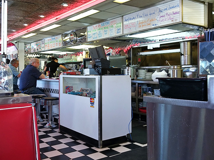 The kitchen ballet unfolds here &ndash; where orders are called, pancakes are flipped, and comfort is created with choreographed precision.