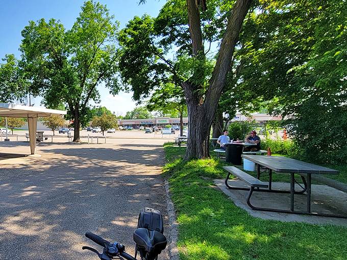 The outdoor seating area provides a peaceful retreat where generations have gathered to enjoy simple pleasures on summer days.