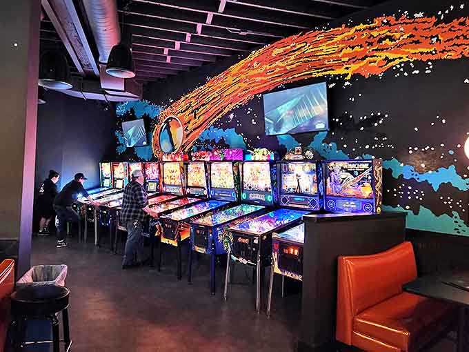 Players lose themselves in the hypnotic flow of pinball, where flashing lights and satisfying mechanical clicks create pure gaming joy.